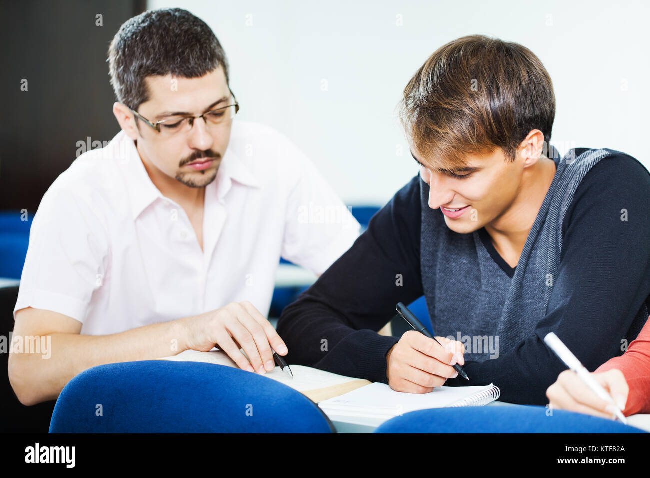 Class teacher telling students hi-res stock photography and images - Alamy