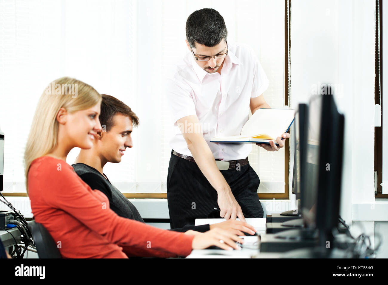 Students learning in computer lab Stock Photo - Alamy