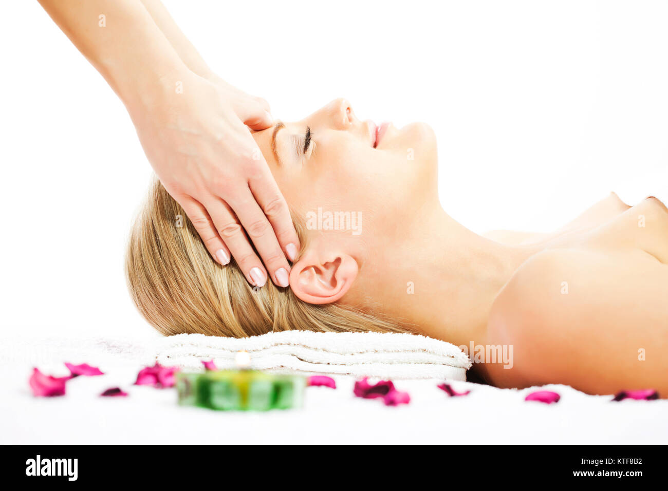 Young woman having forehead massage on spa treatment Stock Photo - Alamy