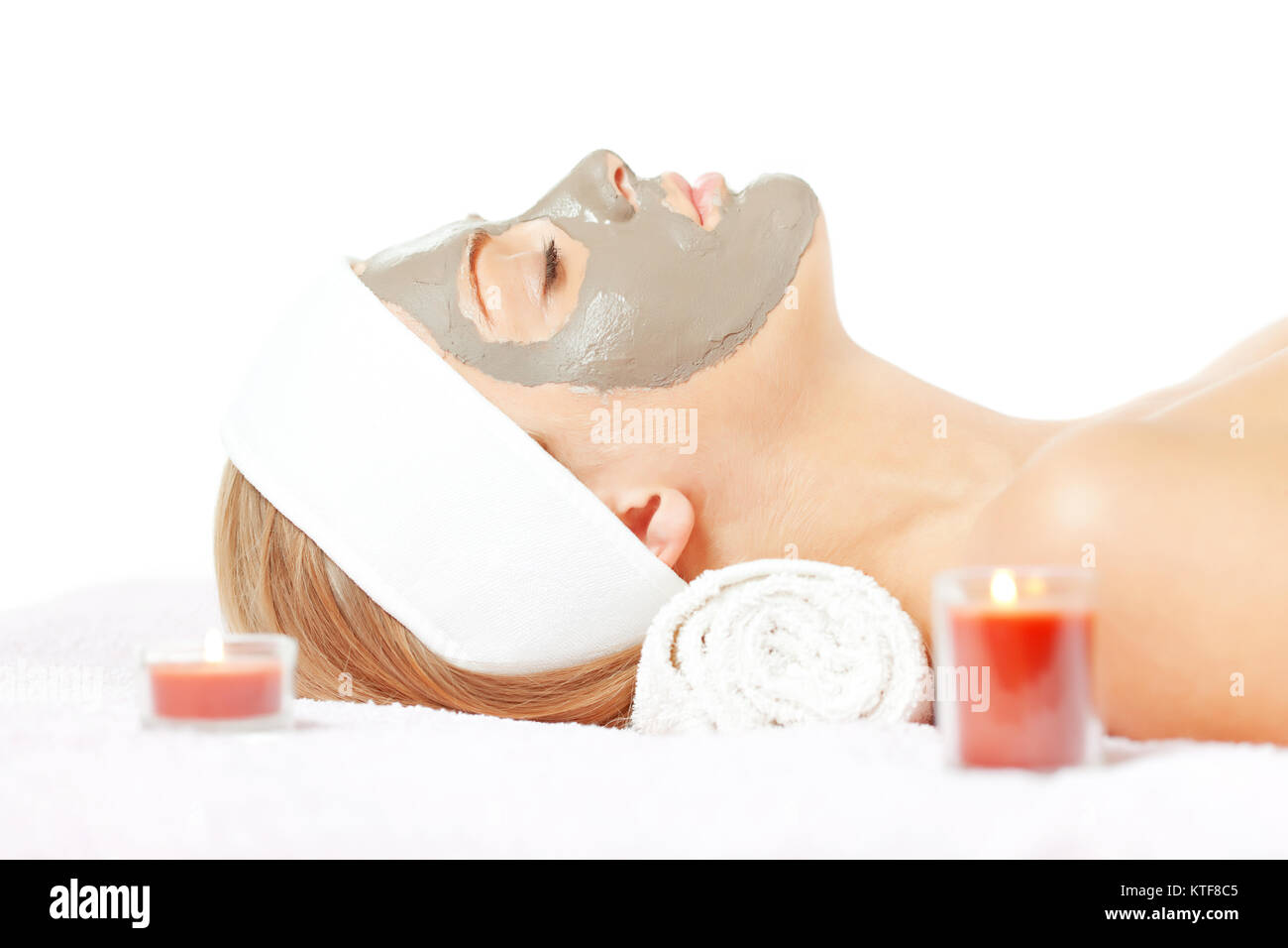 Young woman with clay skin mask on her face Stock Photo - Alamy