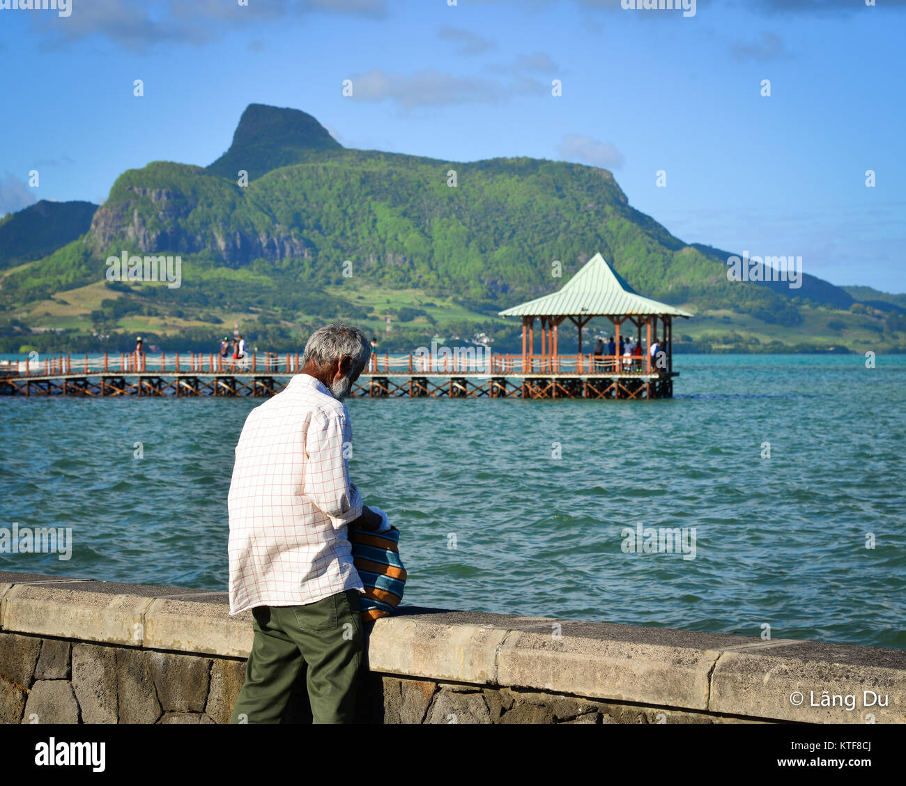 Mahebourg, Mauritius - Jan 3, 2017. A man looking at the sea in ...