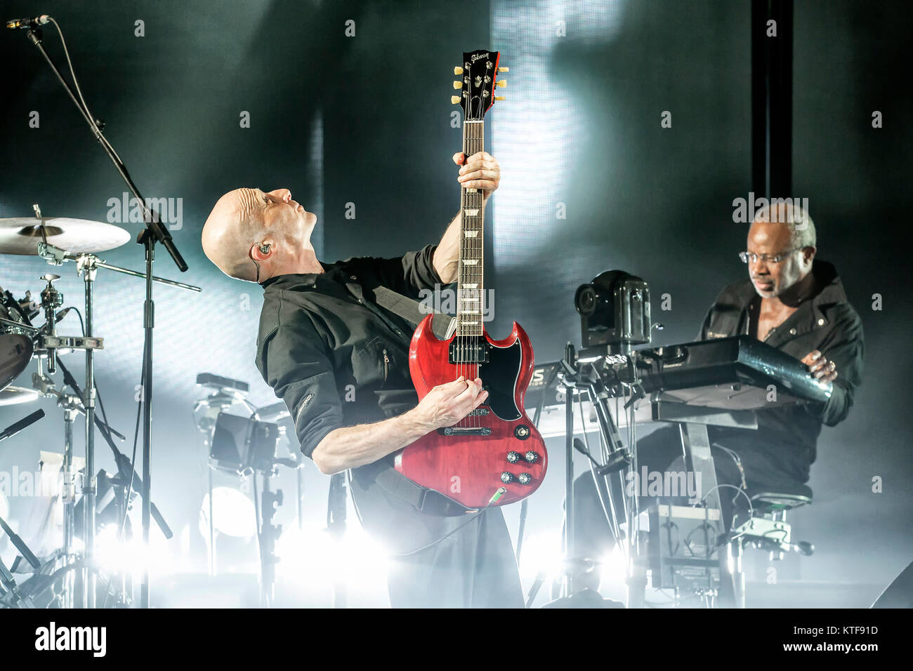 The English musician and composer David Rhodes on guitar performs with ...