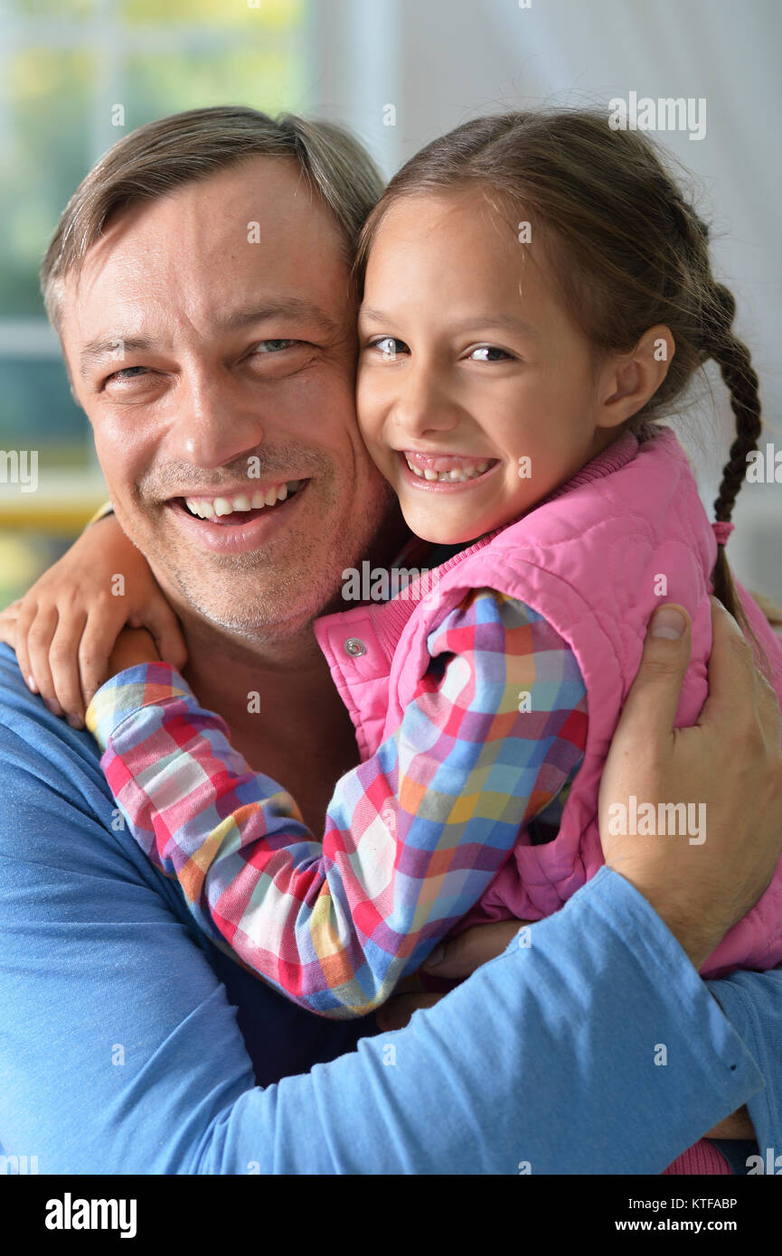 Portrait of a father hugging his daughter Stock Photo - Alamy