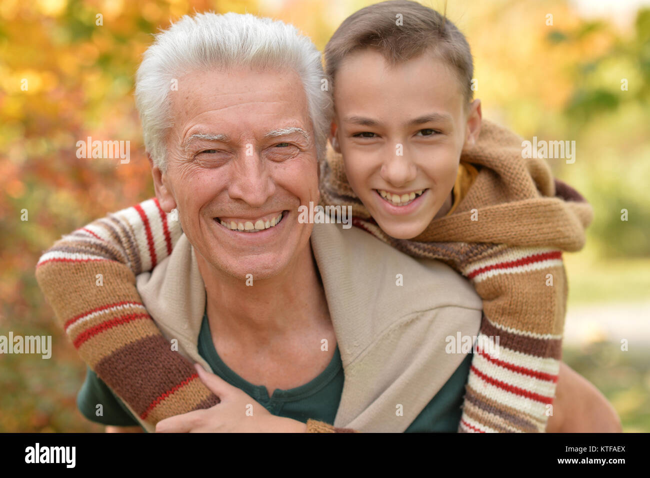 happy grandfather and grandson hugging in park Stock Photo - Alamy