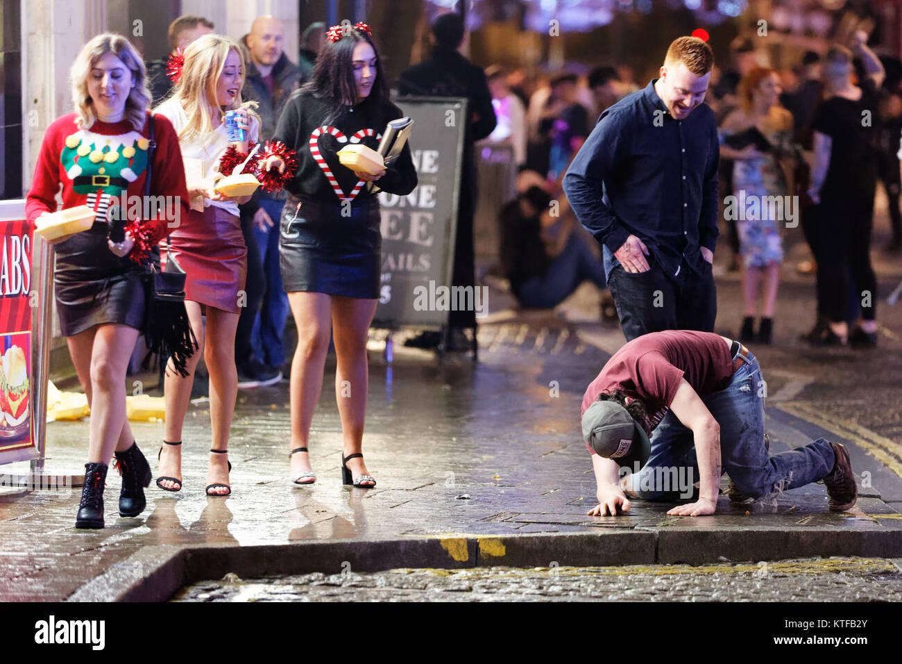 A man falls on the pavement in Wind Street, Swansea, Wales on Mad ...