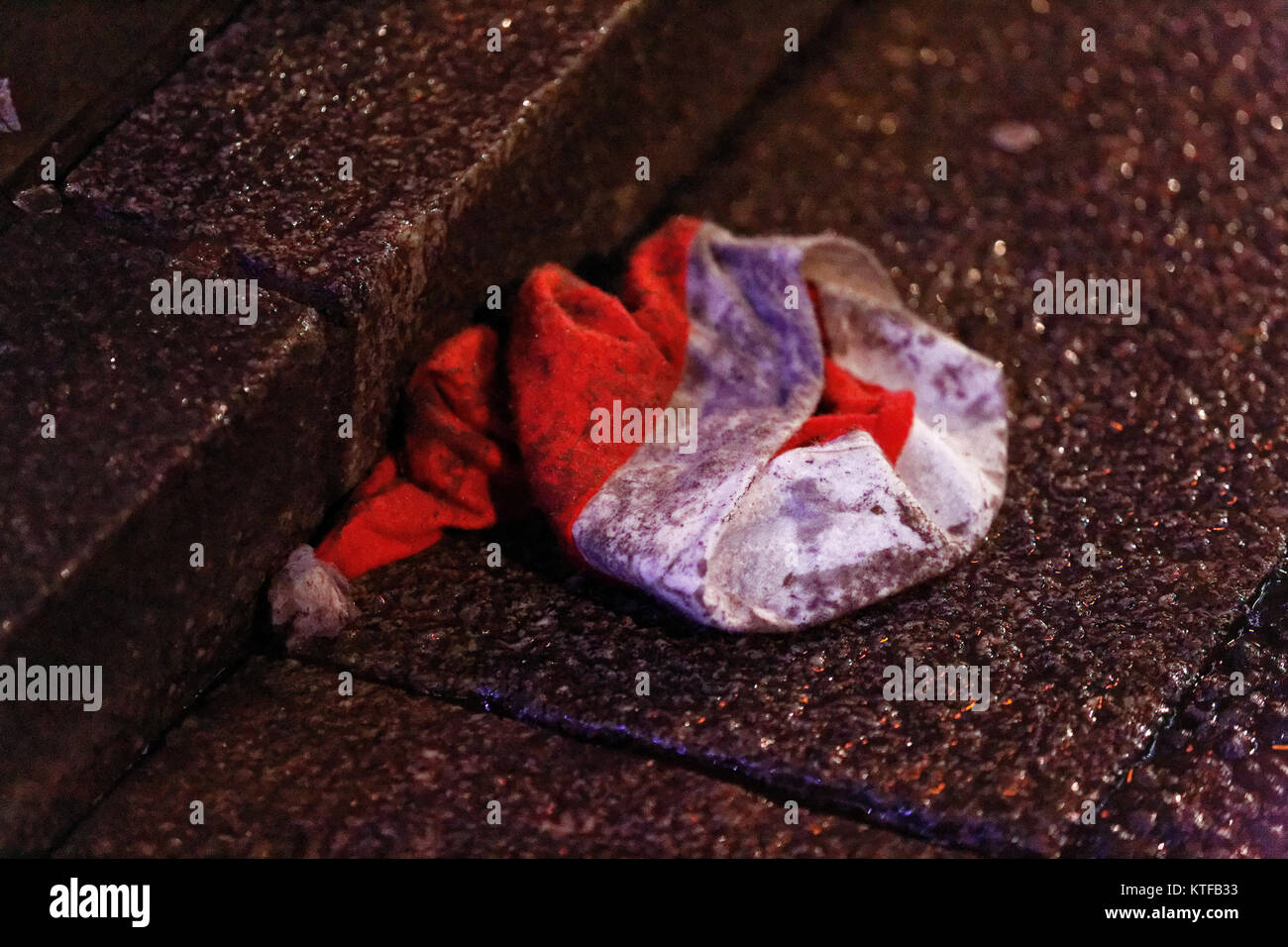 A discarded Santa hat in Wind Street, Swansea, Wales on Mad Friday ...