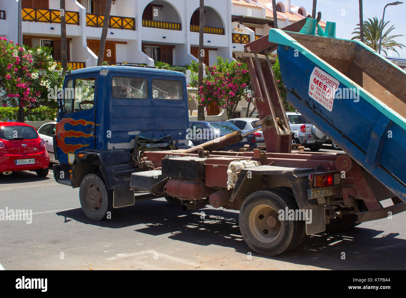 A tipper lorry with its tipper extended after shedding its load of ...