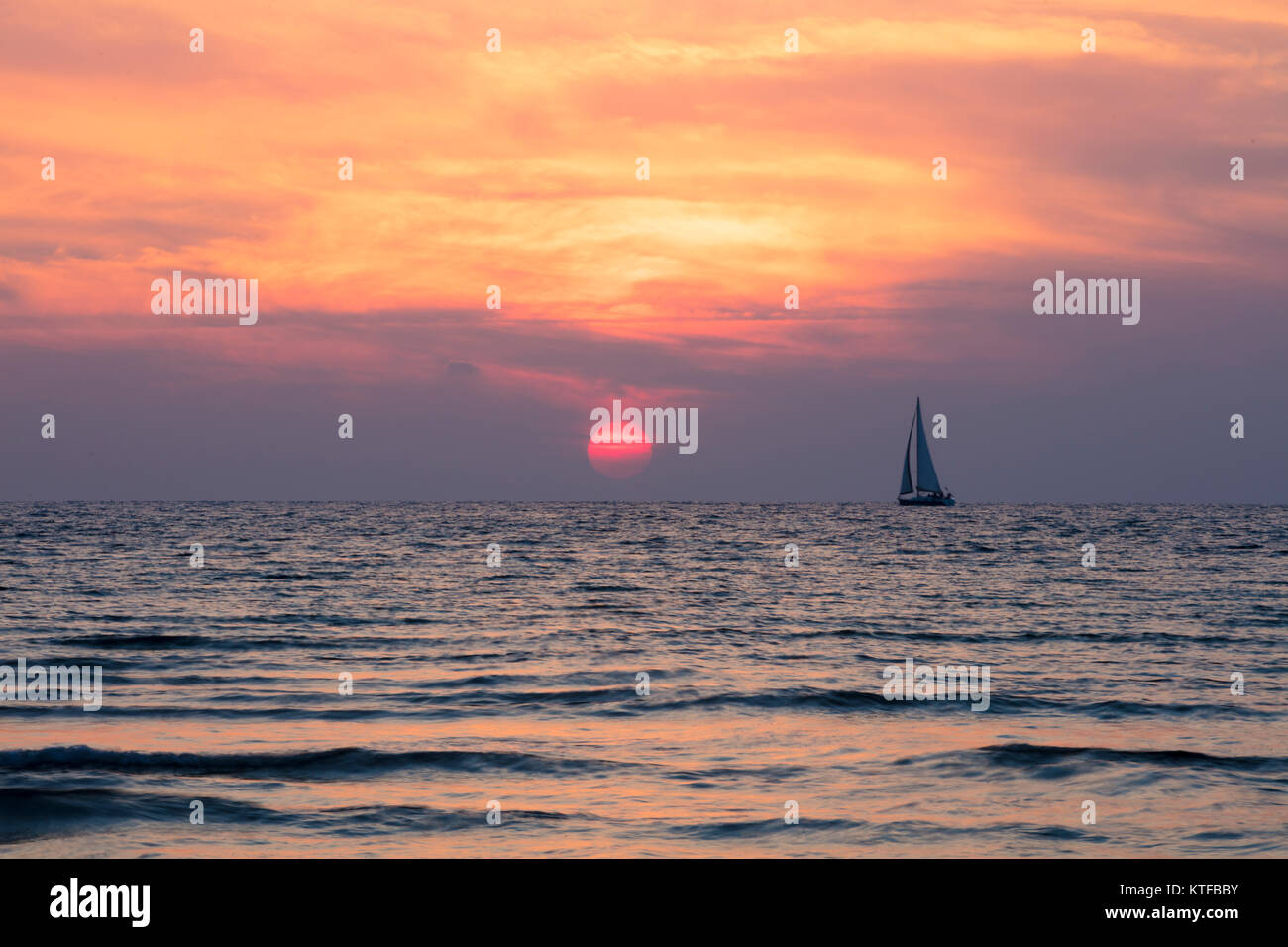 Seashore in evening. Beautiful sunset over sea Stock Photo - Alamy