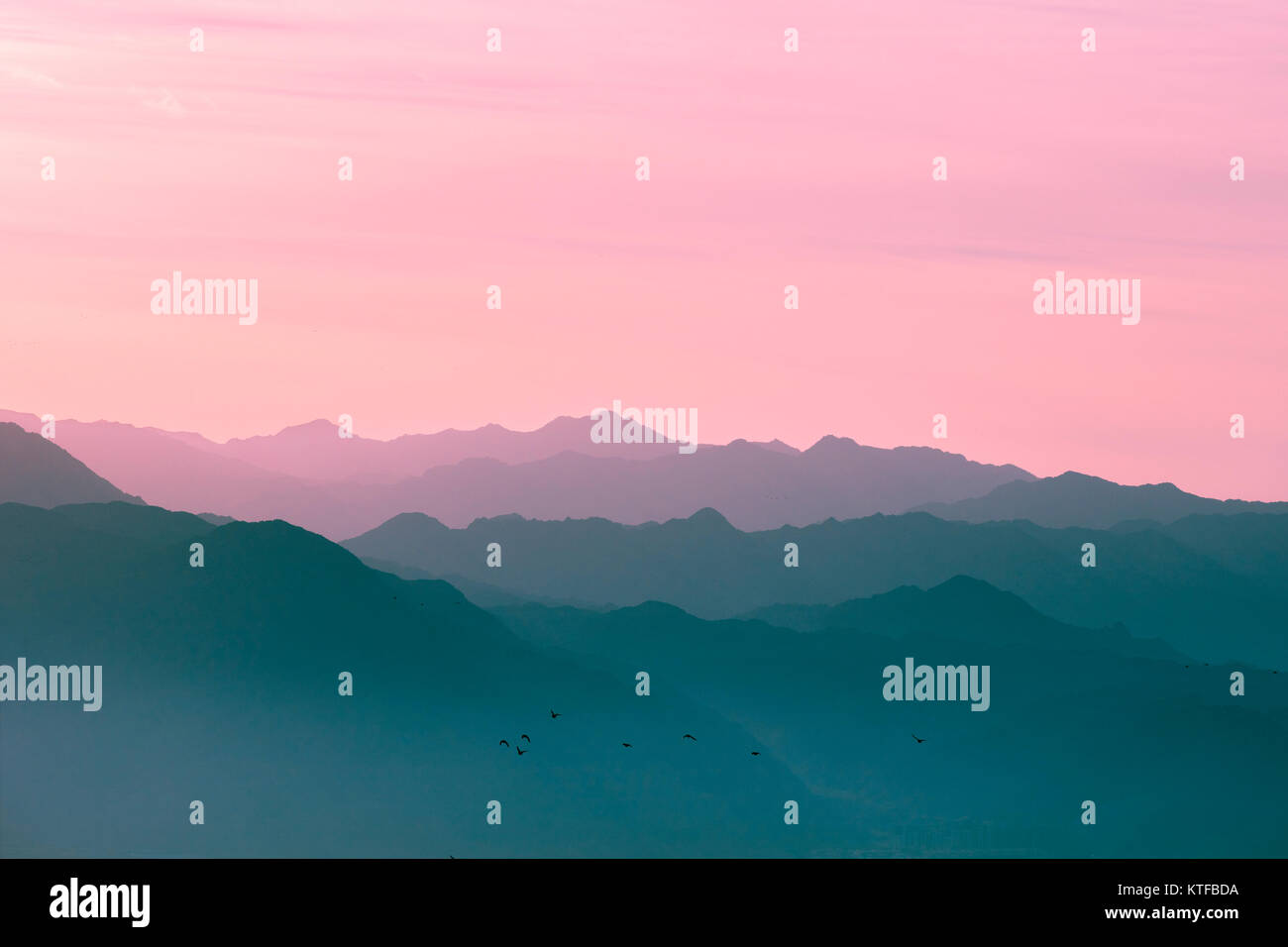 Mountain range at sunrise light Stock Photo - Alamy