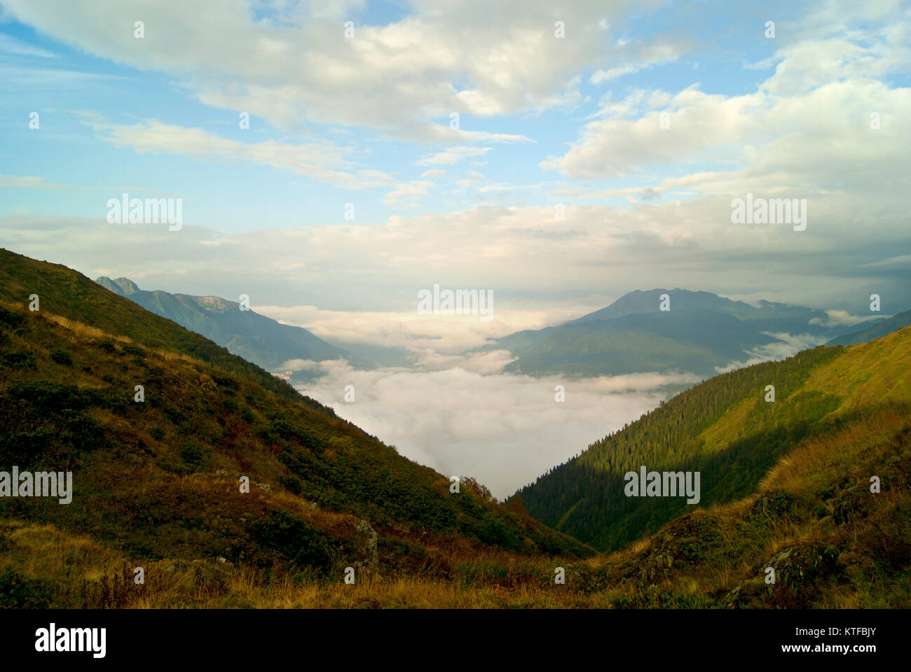 A view from the edge of a mountain plateau to a plain covered with ...