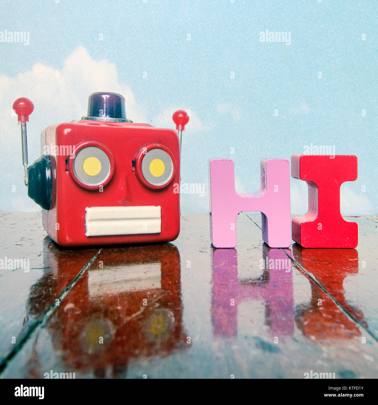 red robot head and the word HI on a wooden floor with reflection Stock ...