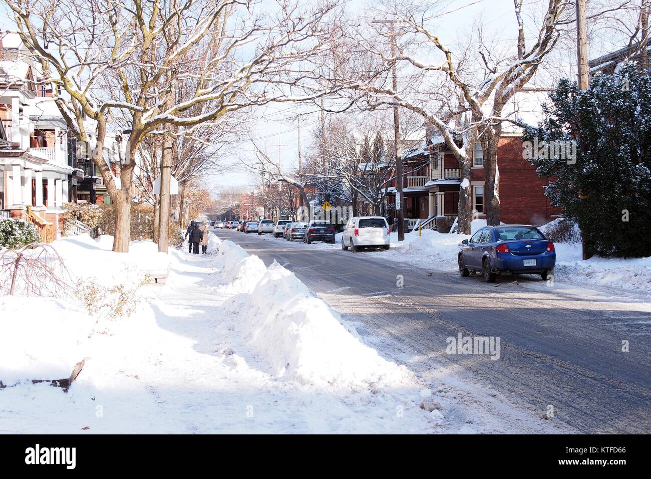 Fresh snow on a Glebe street, Ottawa, Ontario, Canada. Plowed snow ...