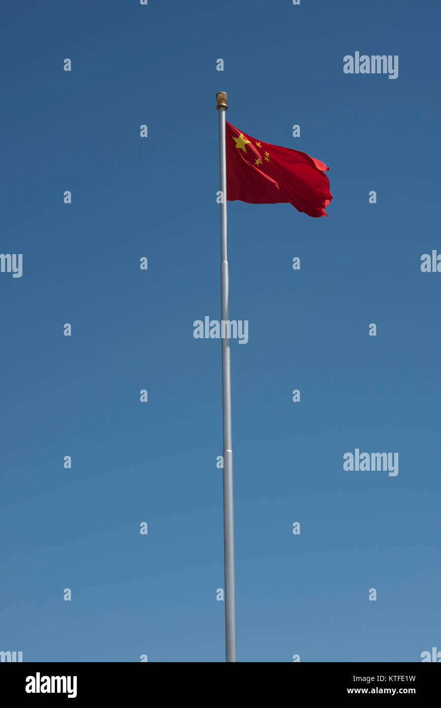 Flying Chinese National Flag against blue sky Stock Photo - Alamy