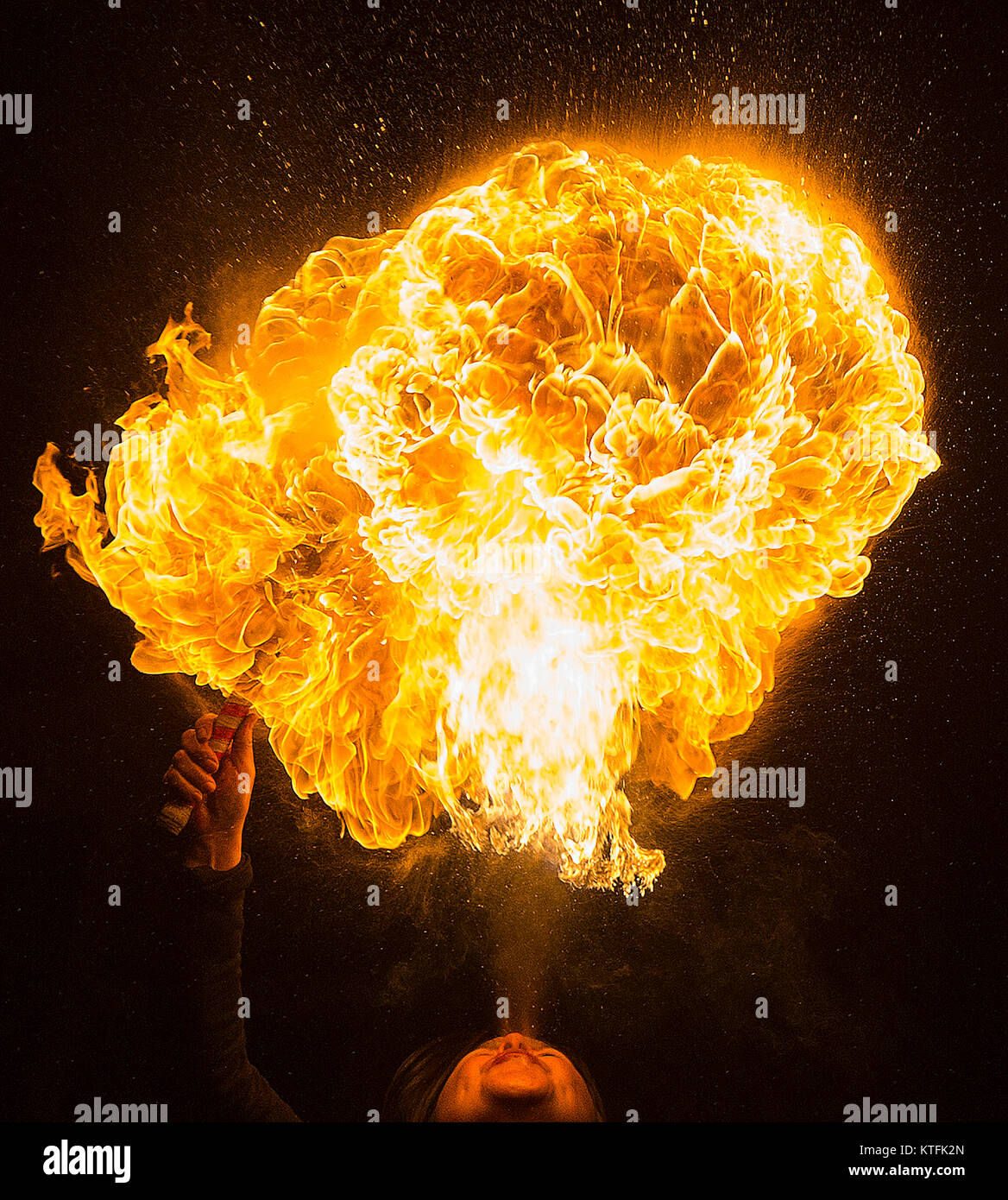 Beijing, Canada. 21st Dec, 2017. A performer blows a huge fireball ...