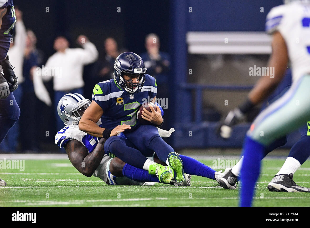 Arlington, Texas, USA. 24th Dec, 2017. Seattle Seahawks quarterback Russell Wilson (3) is sacked ...