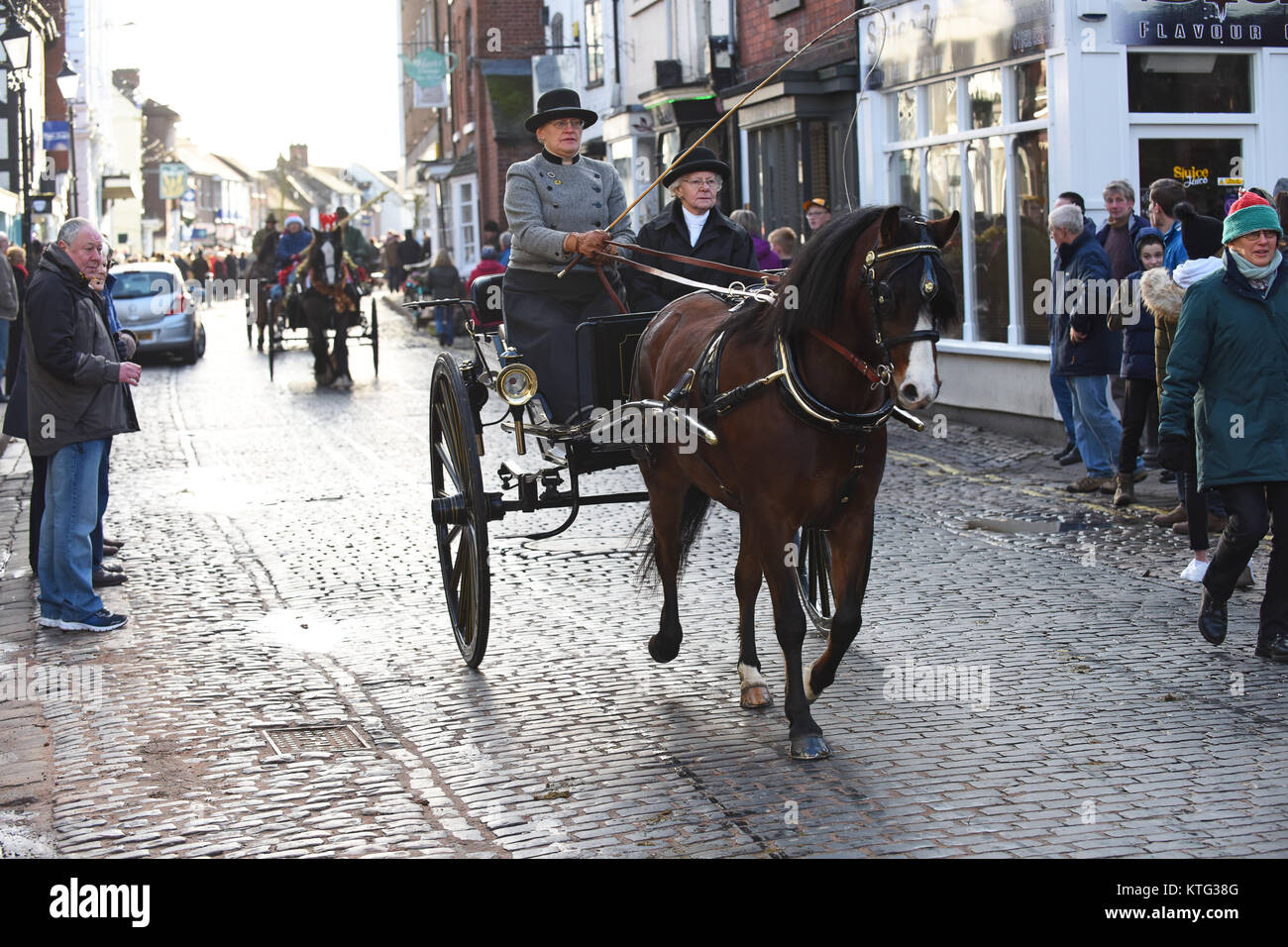 Horses and carriages follow the The Albrighton Hunt Boxing Day hunt ...