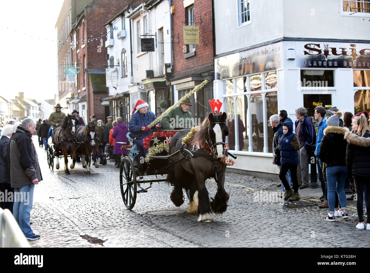 Horses and carriages follow the The Albrighton Hunt Boxing Day hunt ...