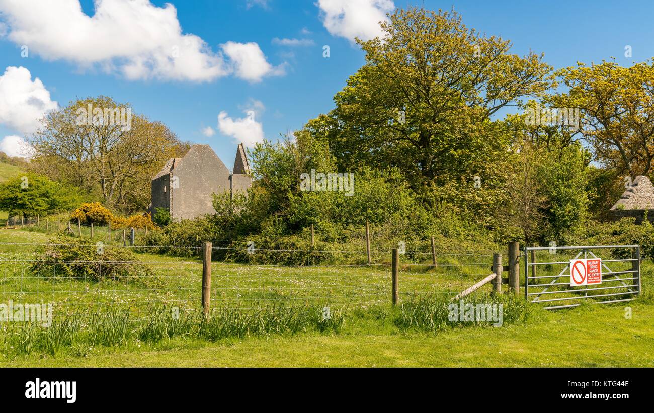 Ruin in the abandoned Tyneham Village and a gate, near Kimmeridge ...