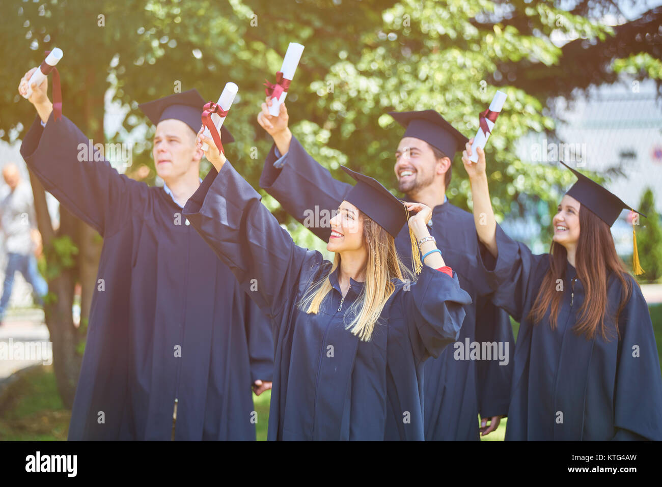 education, graduation and people concept - group of happy international ...