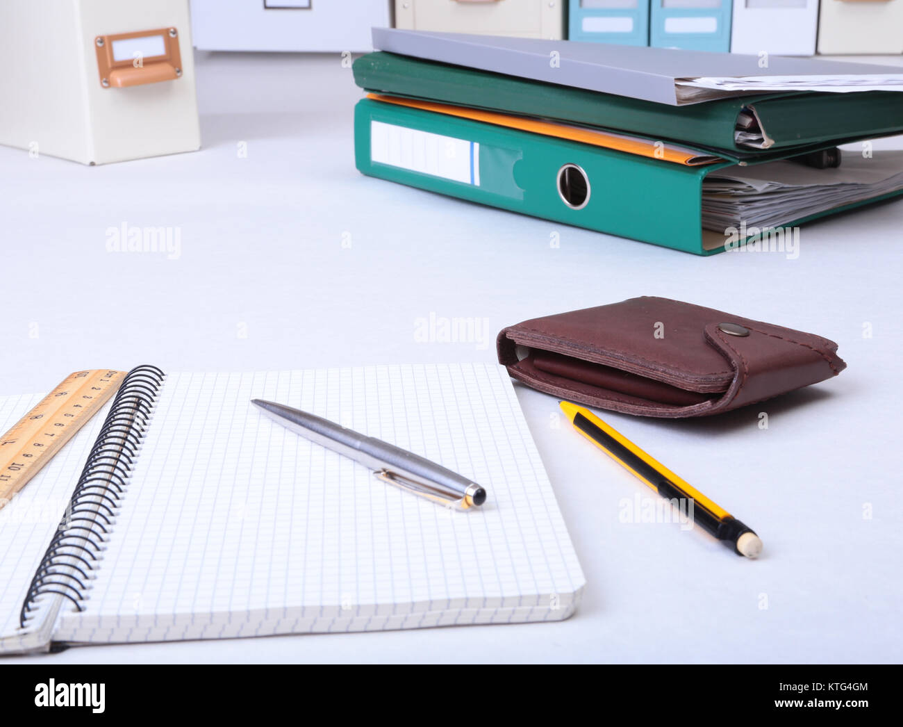 Folder file, note and wallet on the desk. blurred background Stock ...