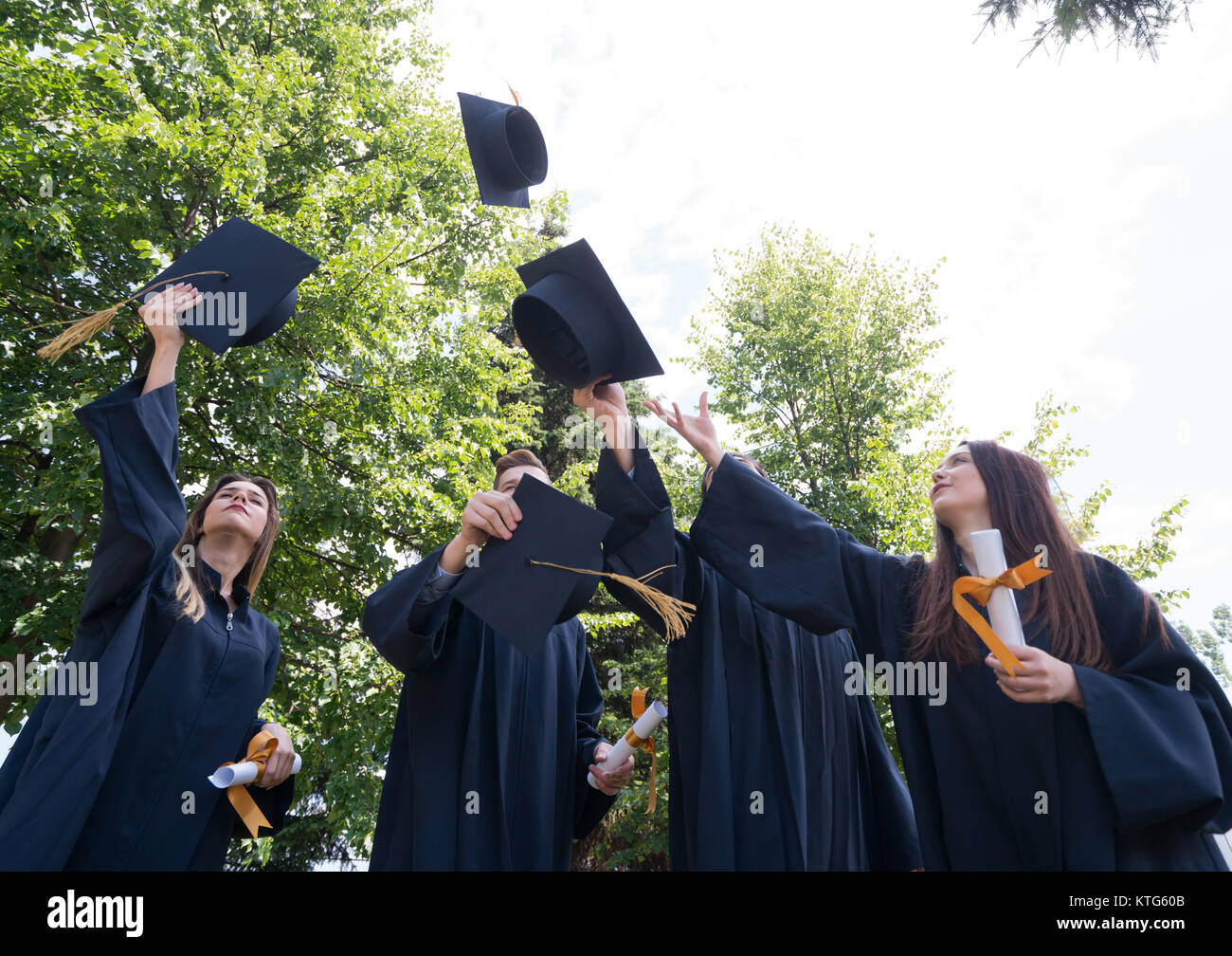 education, graduation and people concept - group of happy international ...