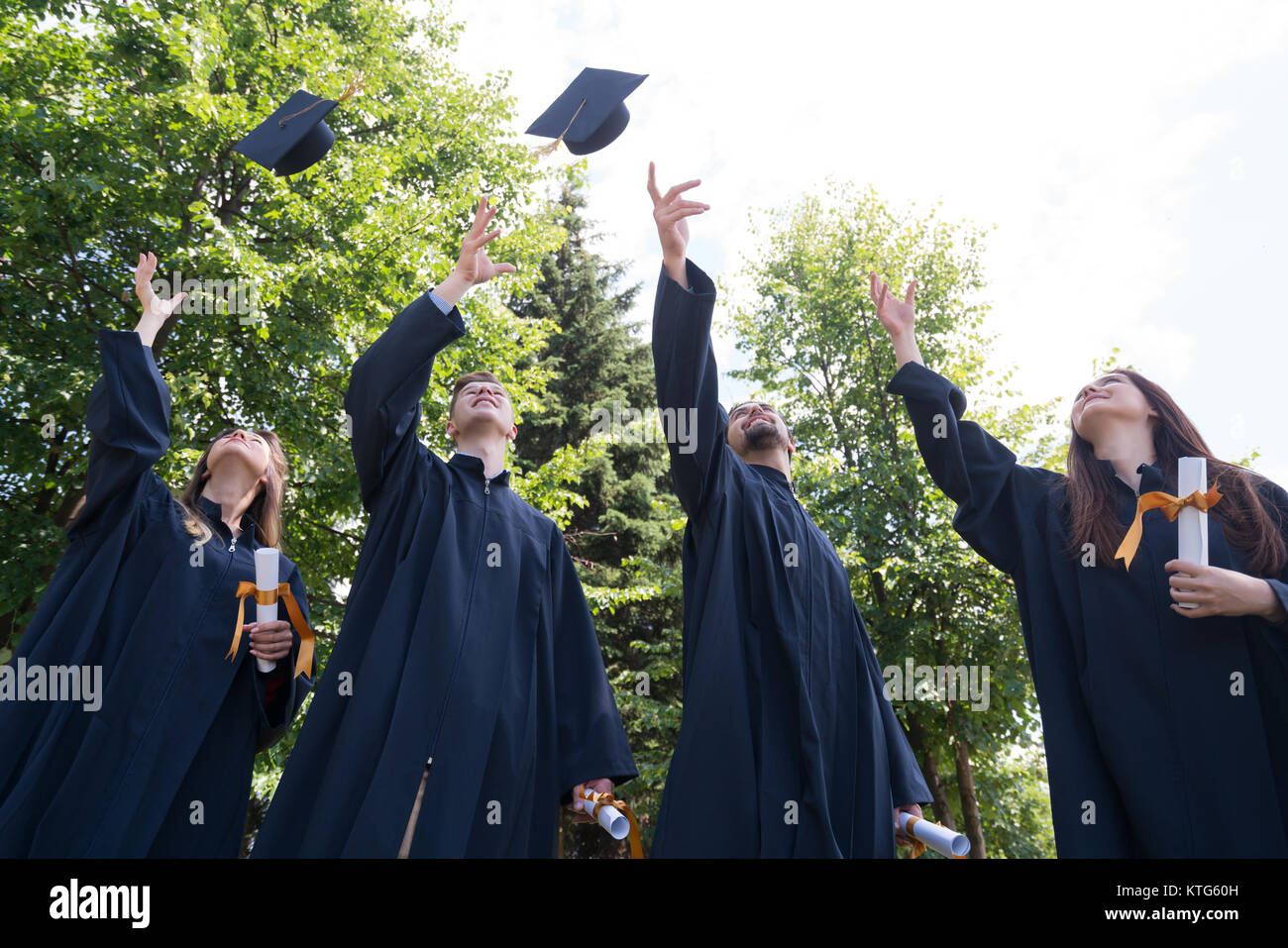 education, graduation and people concept - group of happy international ...