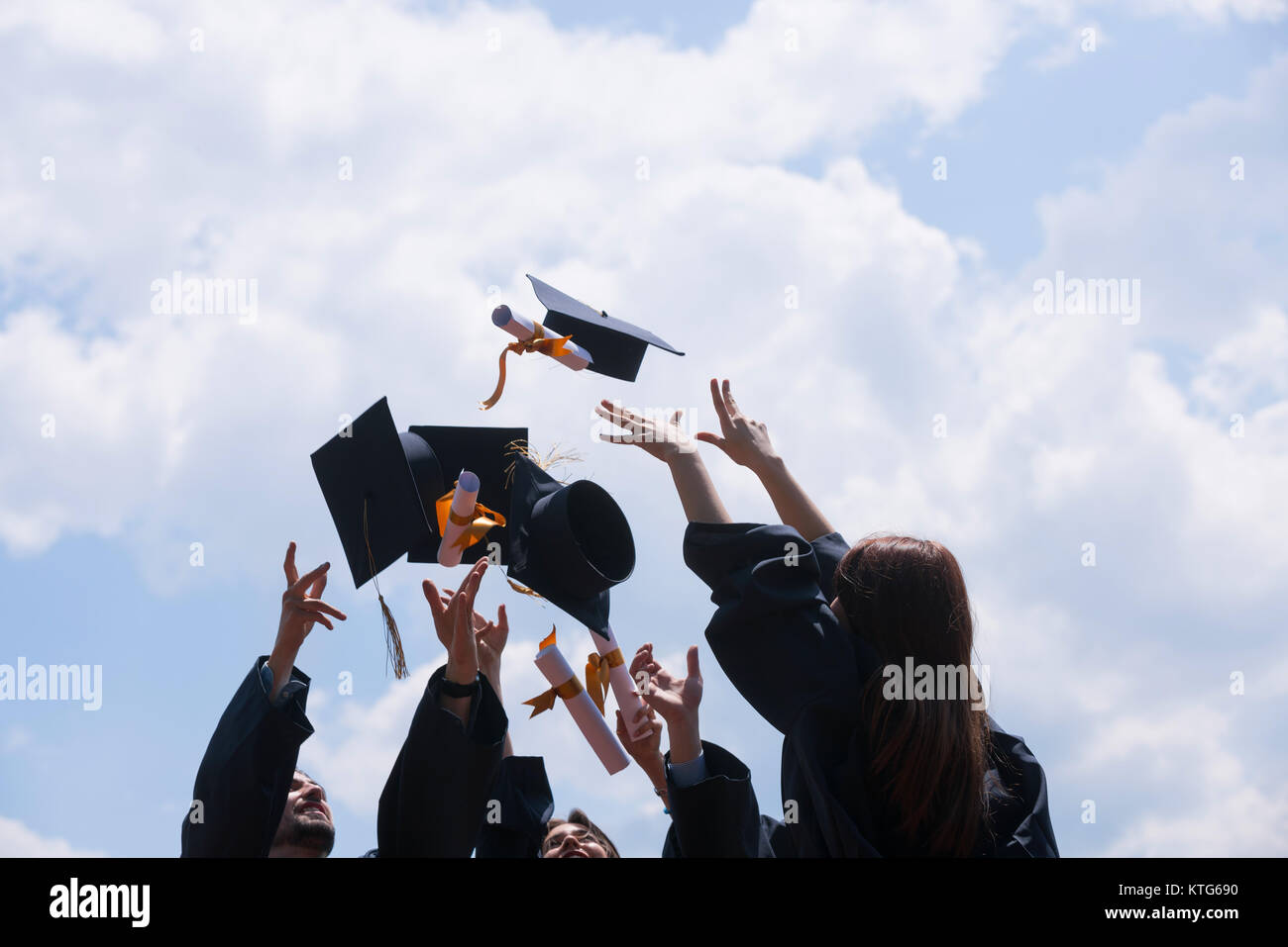 education, graduation and people concept - group of happy international ...