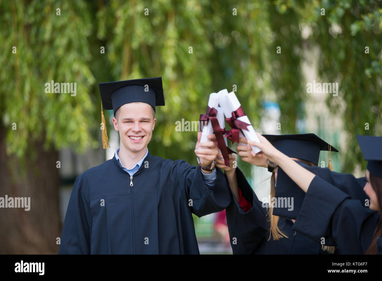 education, graduation and people concept - group of happy international ...