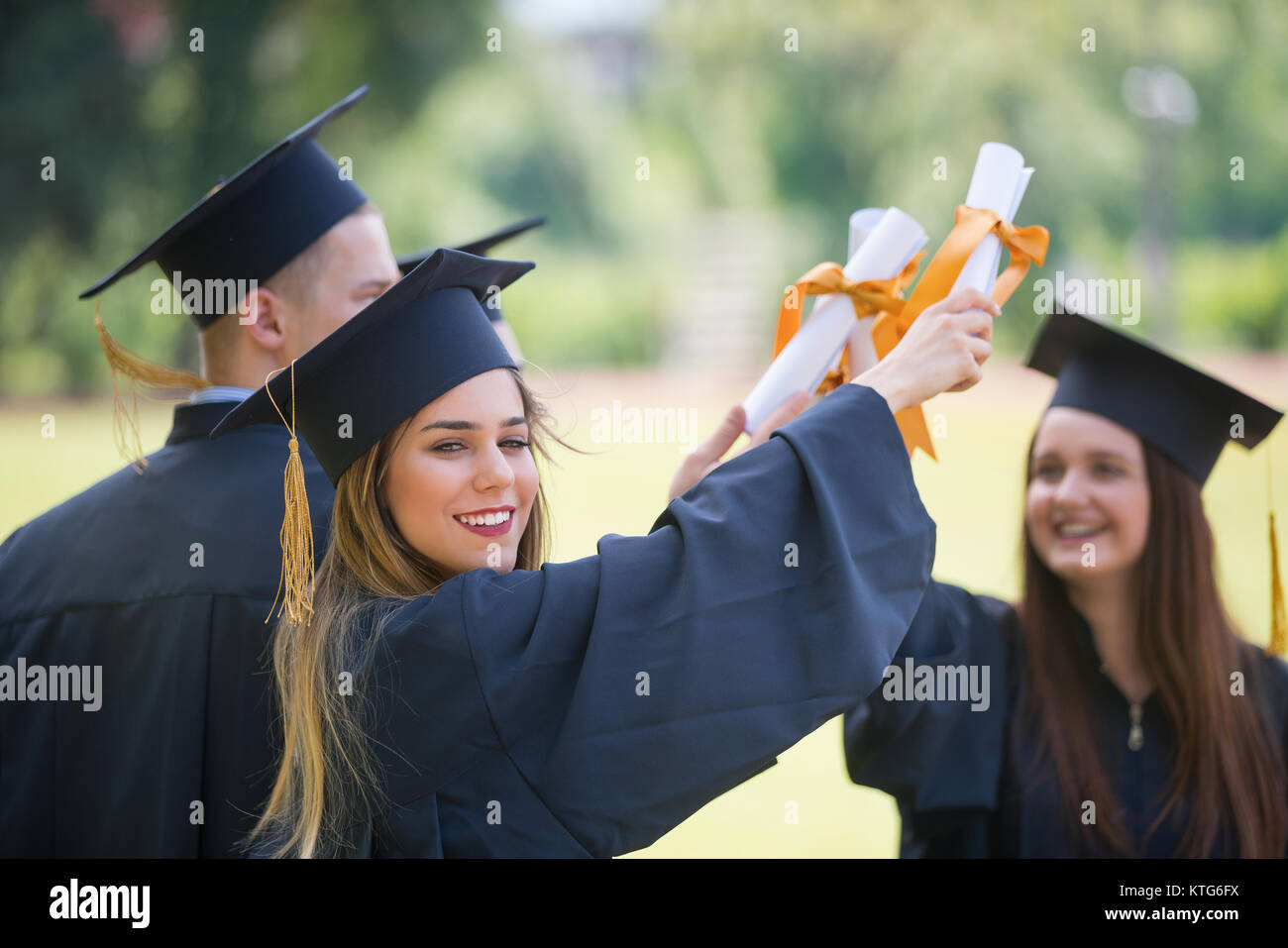 education, graduation and people concept - group of happy international ...