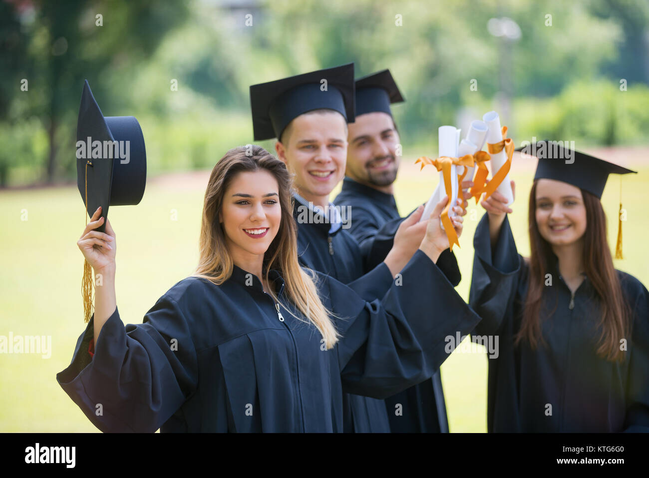 education, graduation and people concept - group of happy international ...