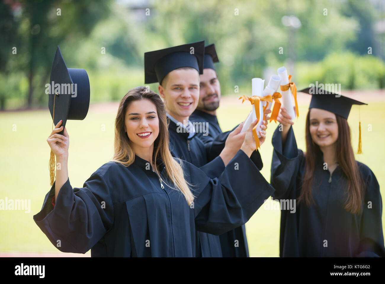 education, graduation and people concept - group of happy international ...