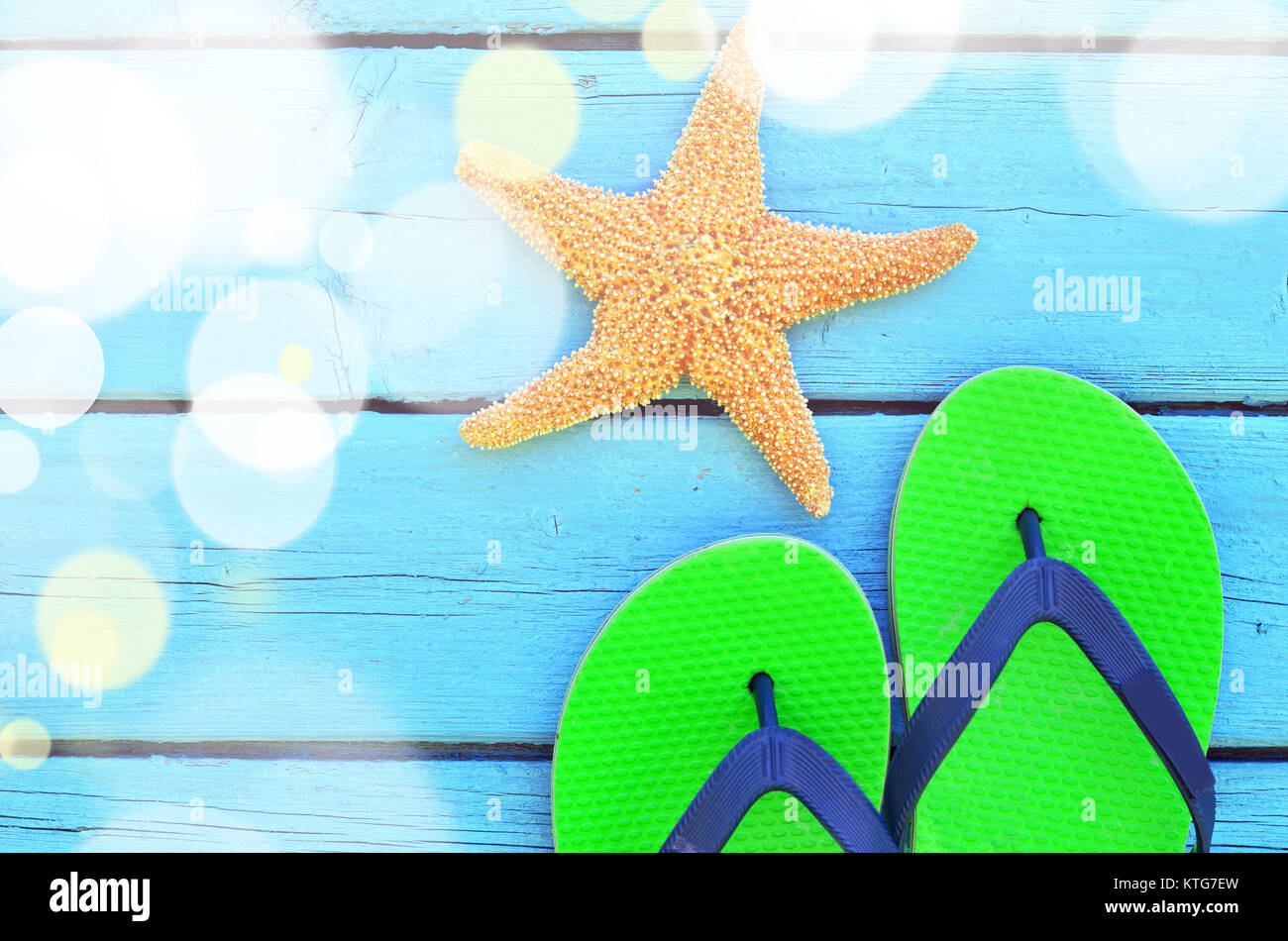 Starfish and flip flops on a blue deck yacht Stock Photo - Alamy