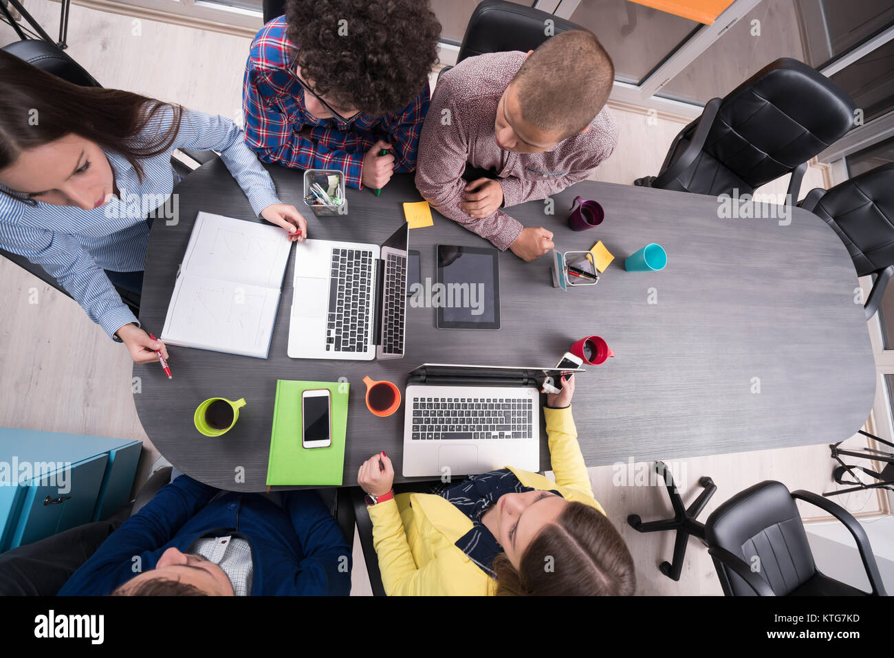 Portrait of startup group of creative people having a meeting with a ...