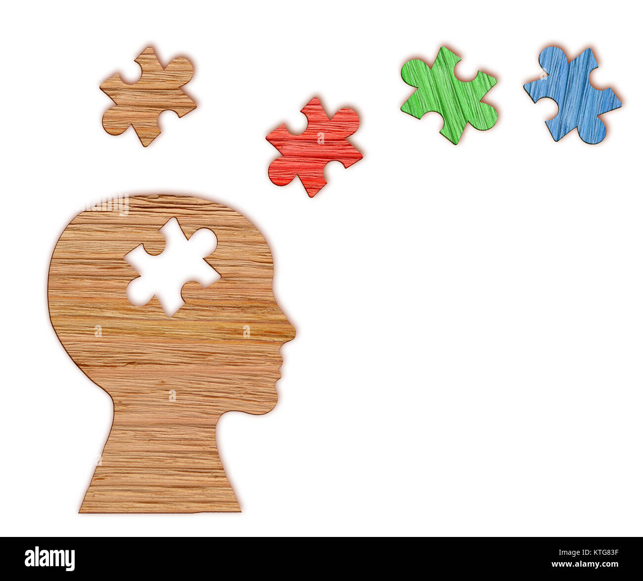 Human head silhouette with a jigsaw piece cut out on white background ...