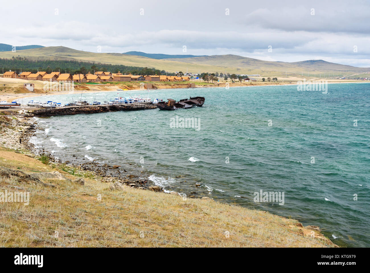 View of Pier with ships and beach in Khuzhir Village on Olkhon Island ...