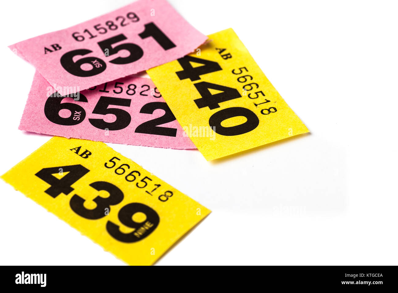 Yellow and Pink Raffle Tickets on white background Stock Photo - Alamy