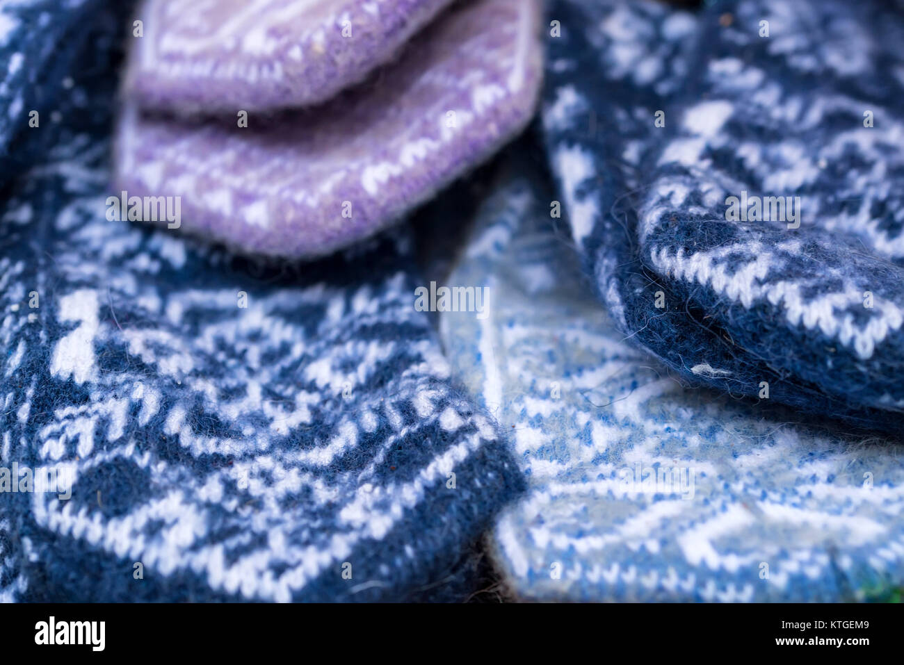 Bunch of handmade colorful woolen mittens Stock Photo - Alamy