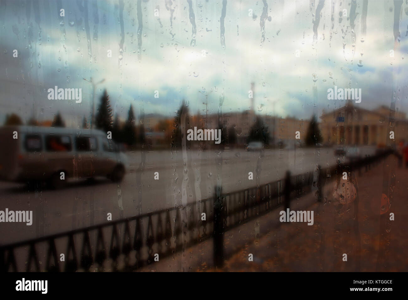 Autumn street on a rainy day view through wet glass Stock Photo - Alamy