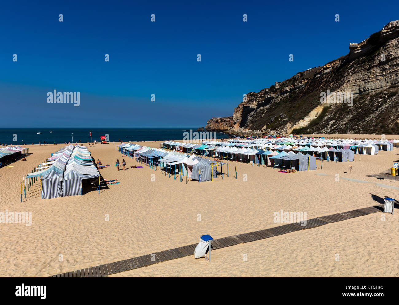 Nazare, Portugal, August 12, 2017: Praia da Nazare beach, covered with ...