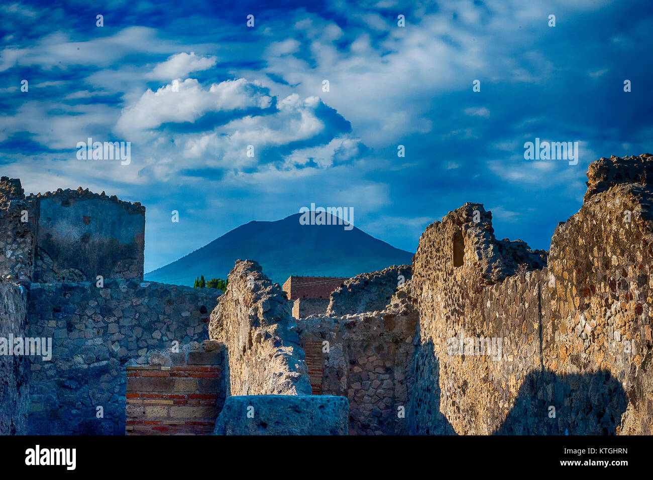 View of the Pompei ruins and Vesuvius volcano in background Stock Photo ...