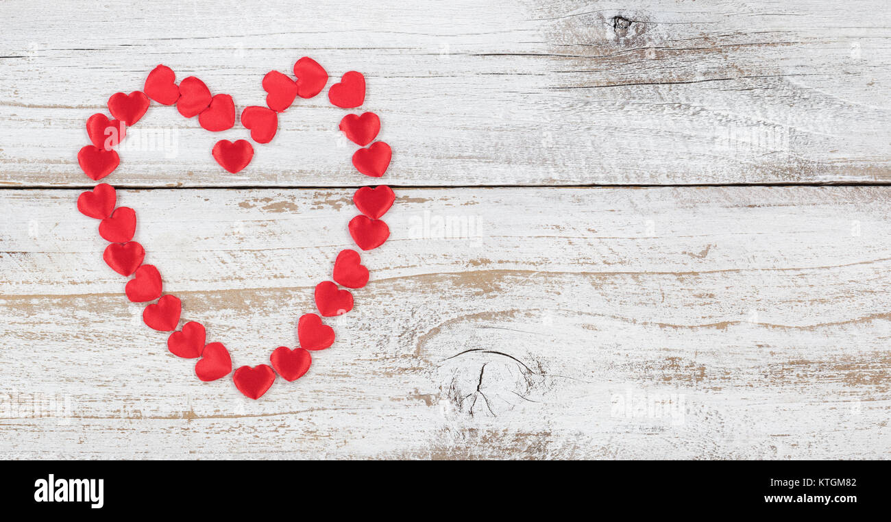 Outline of red heart shapes on rustic white wood in flat lay view Stock ...