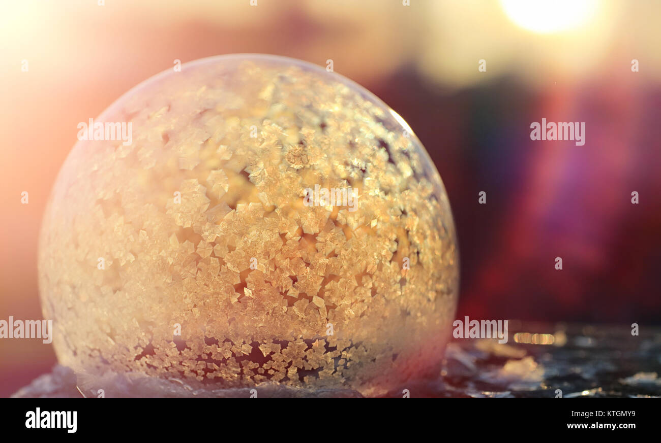 Soap bubbles freeze in the cold. Winter soapy water freezes in air ...