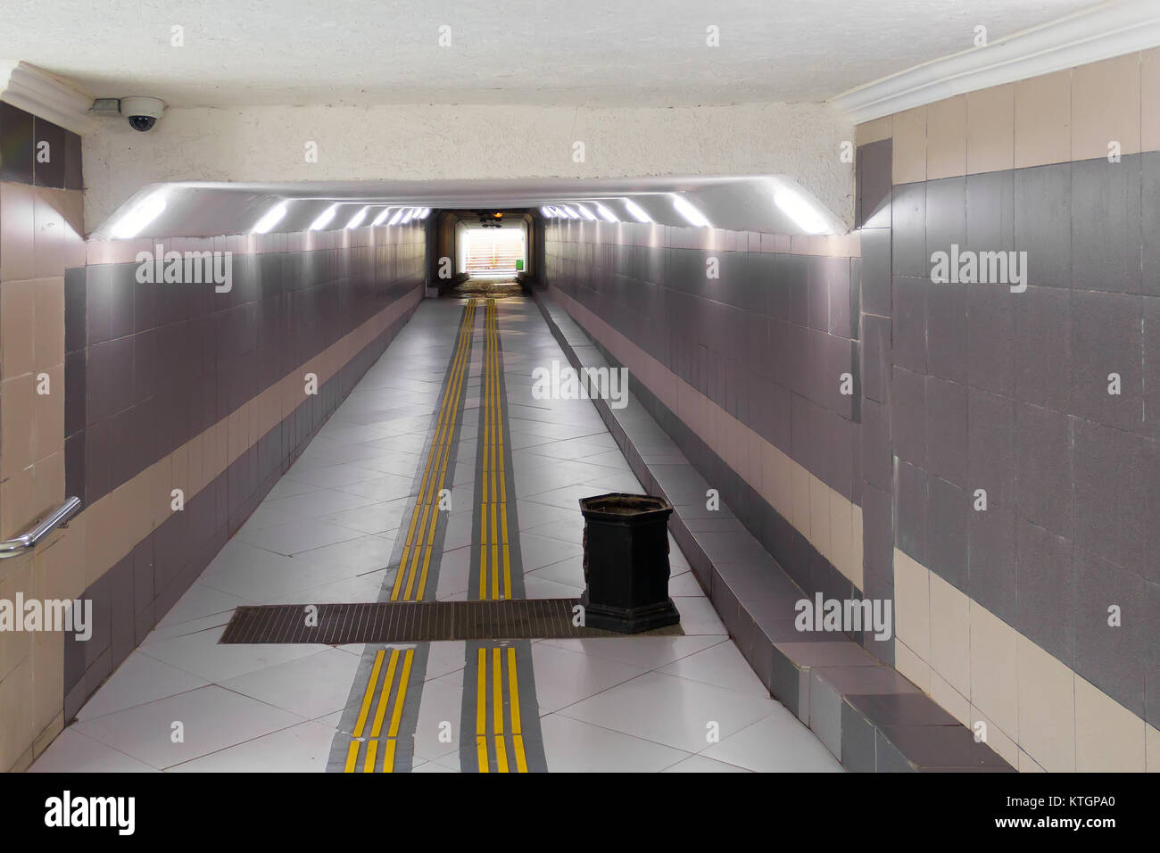 lighted underground passage under the highway, with a low ceiling Stock ...