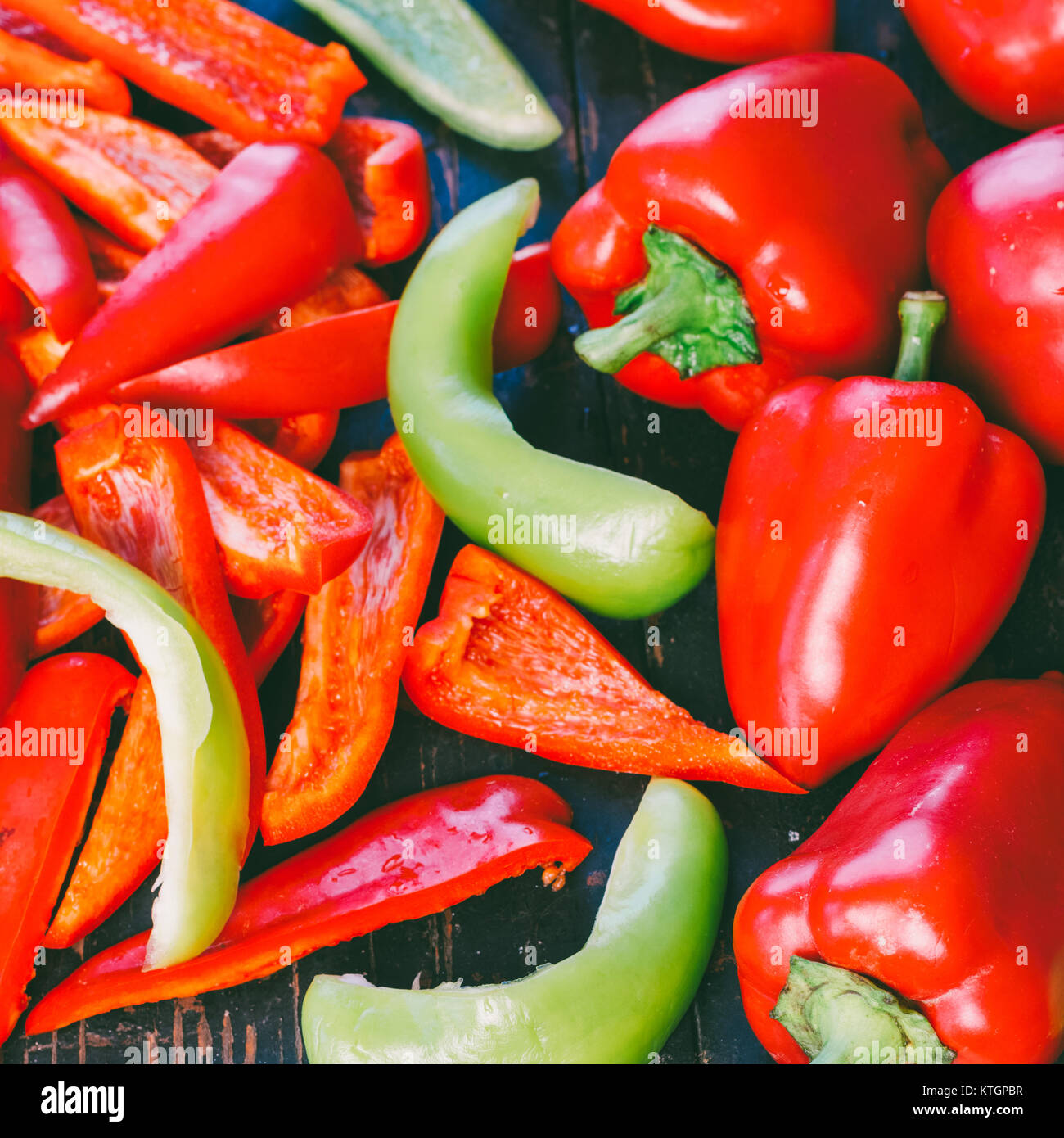 whole and sliced red and green bell pepper close-up Stock Photo - Alamy