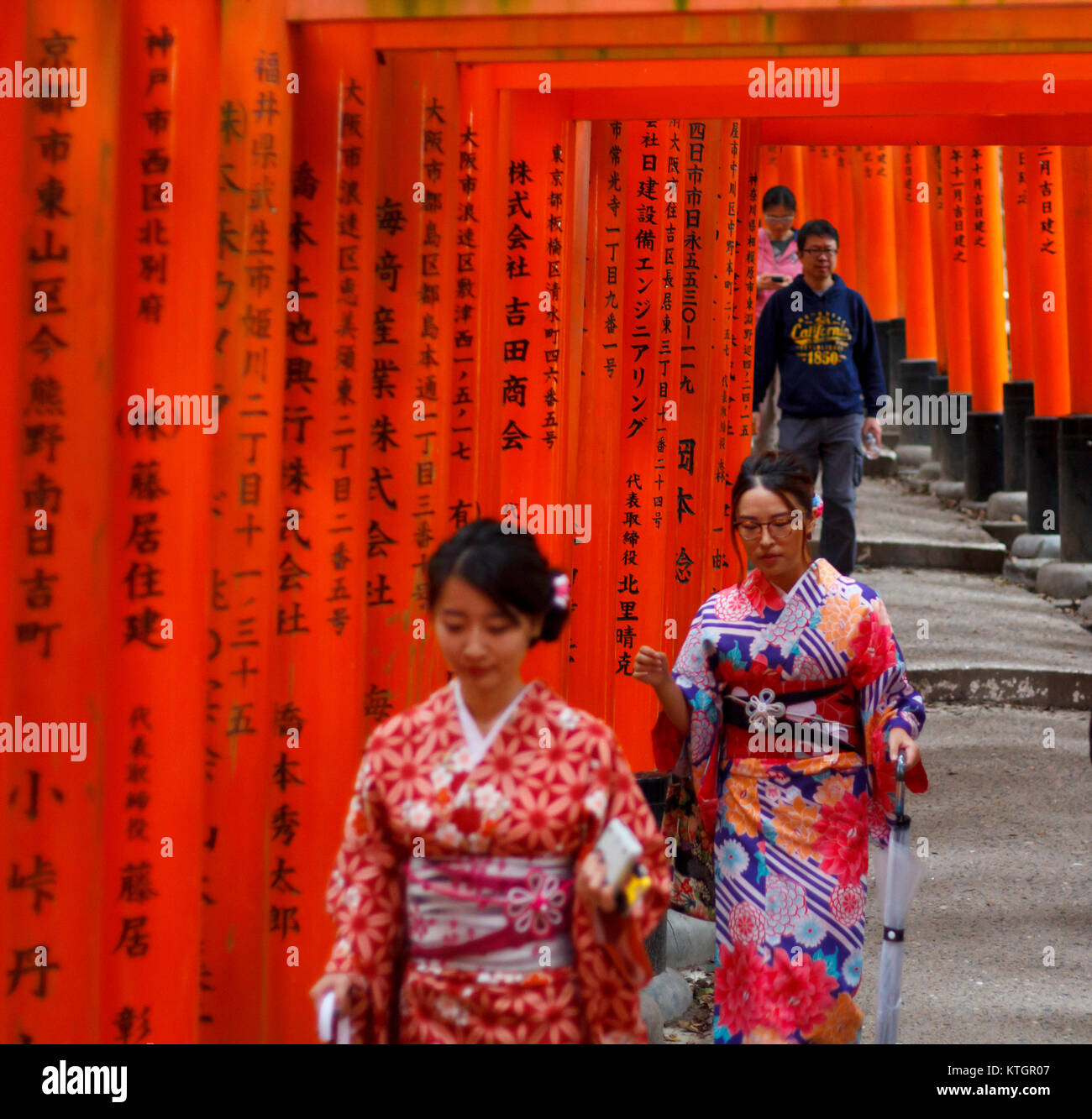 Women dressed in traditional Kimono in Fushimi Inari, a path up to the ...