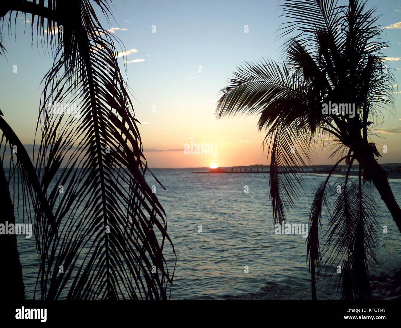 'Atardecer el Yaque' translates to 'Sunset at El Yaque,' likely ...