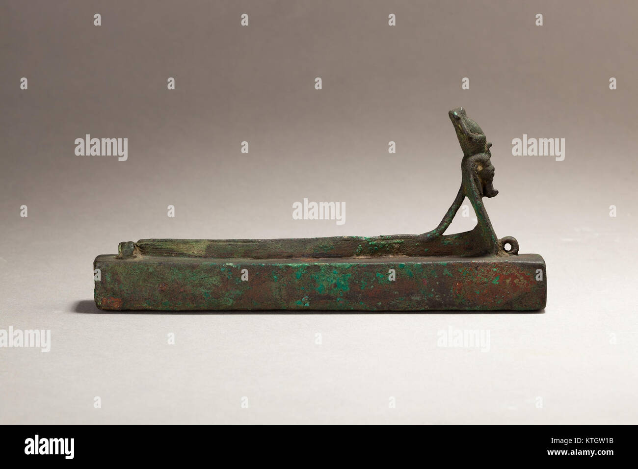 Atum, depicted as a human-headed cobra, surmounts a box for an animal ...