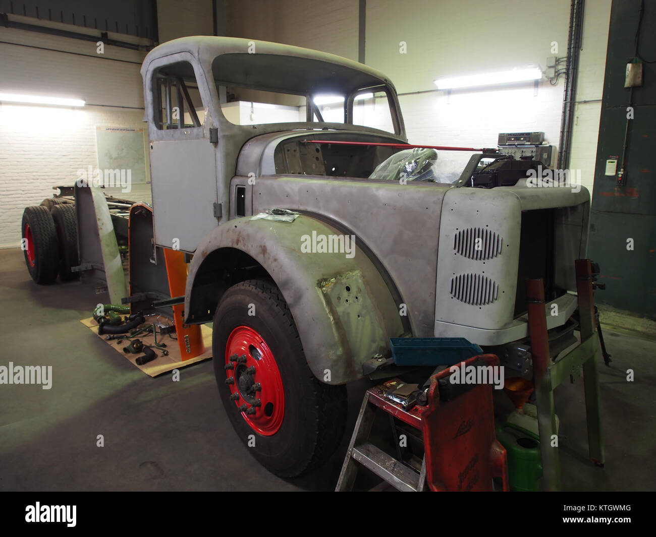 Photograph showing a Volvo truck undergoing restoration. The truck is ...