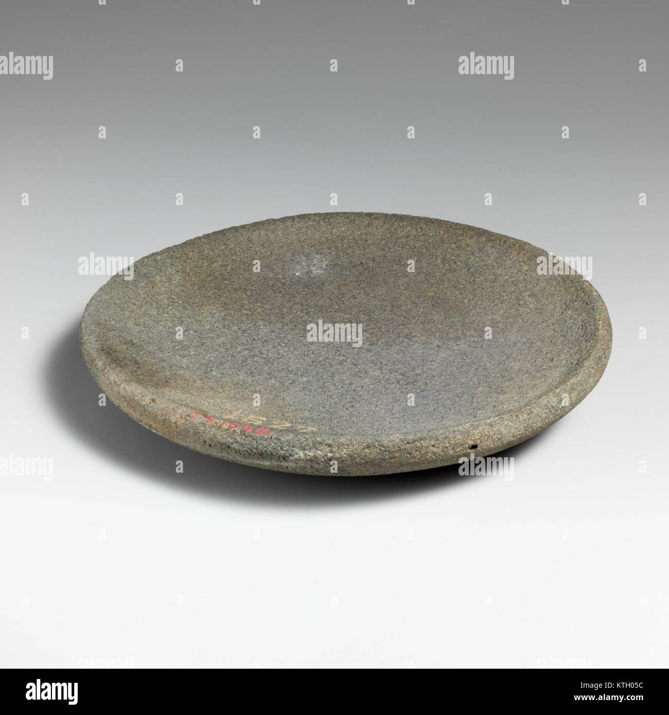This basalt mortar or plate, cataloged in the Metropolitan Museum of ...