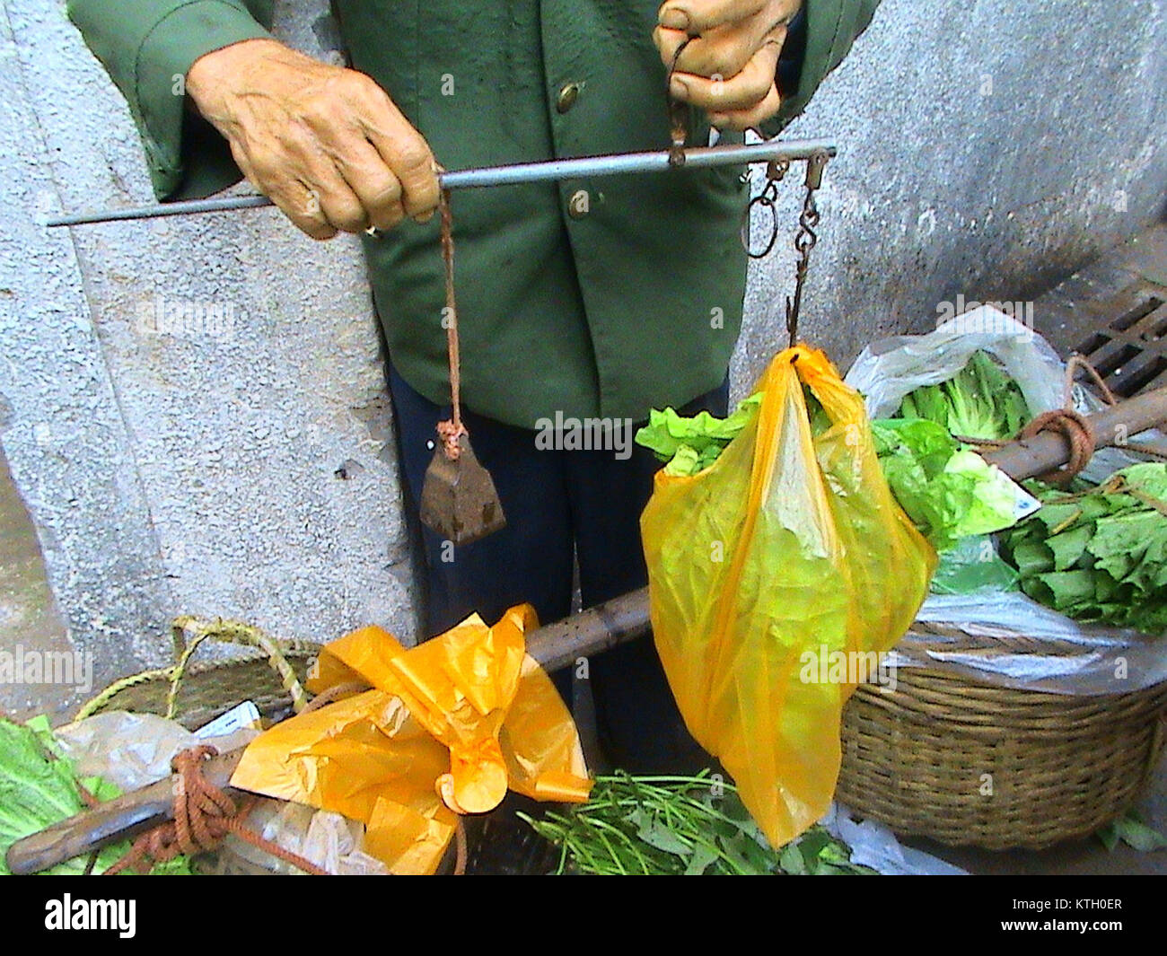 The balance scales in this image represent a traditional tool used in ...